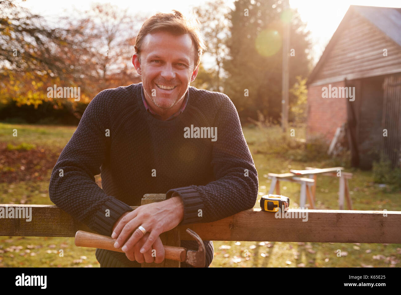 Portrait Of Mature Man Repairing Garden Fence Stock Photo - Alamy