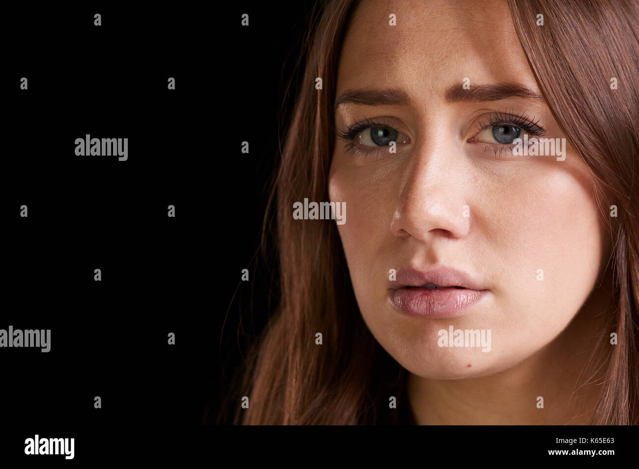Close Up Head And Shoulders Studio Portrait Of Anxious Woman Stock ...