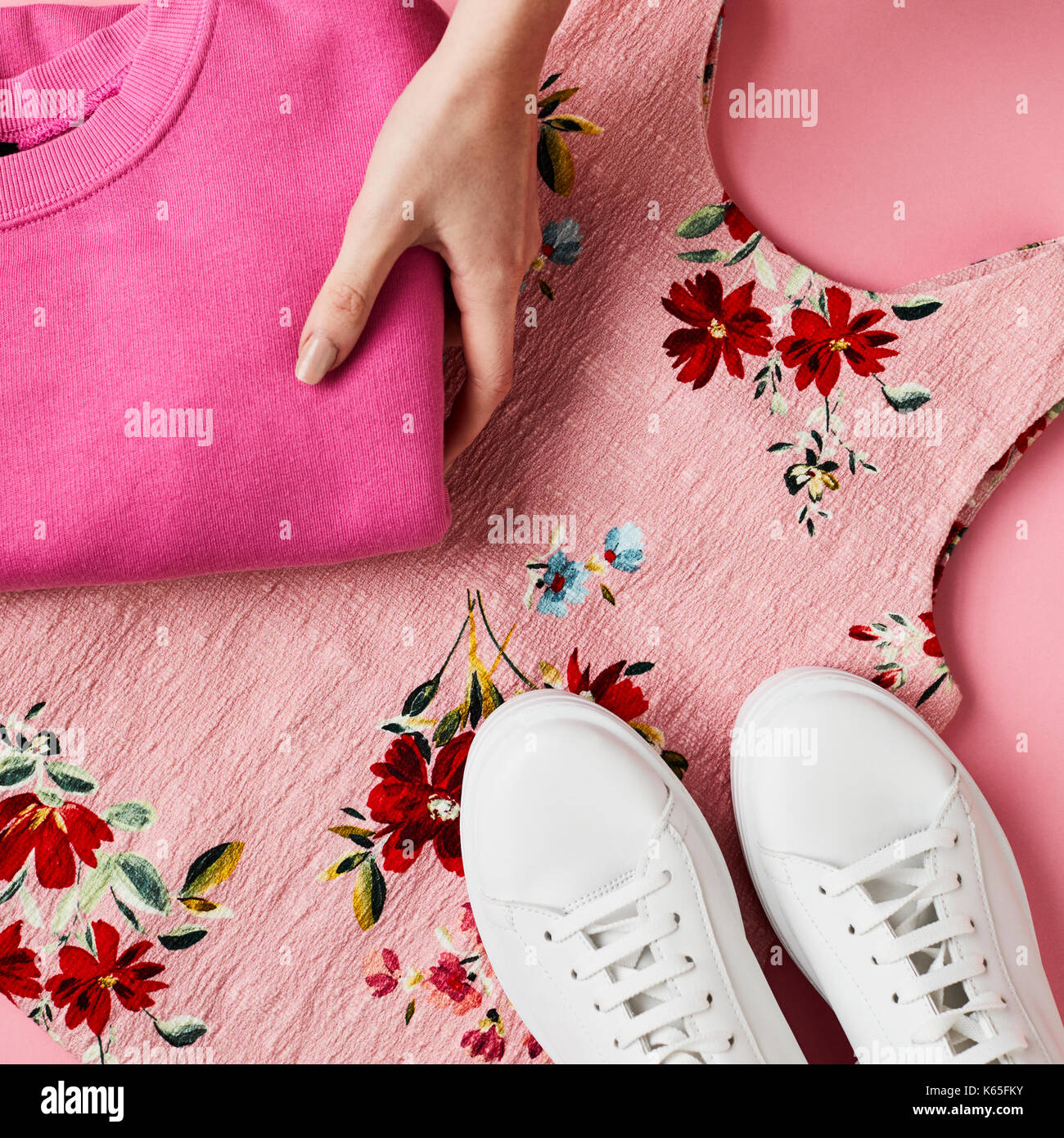 Female hands arranging clothing hi-res stock photography and images - Alamy