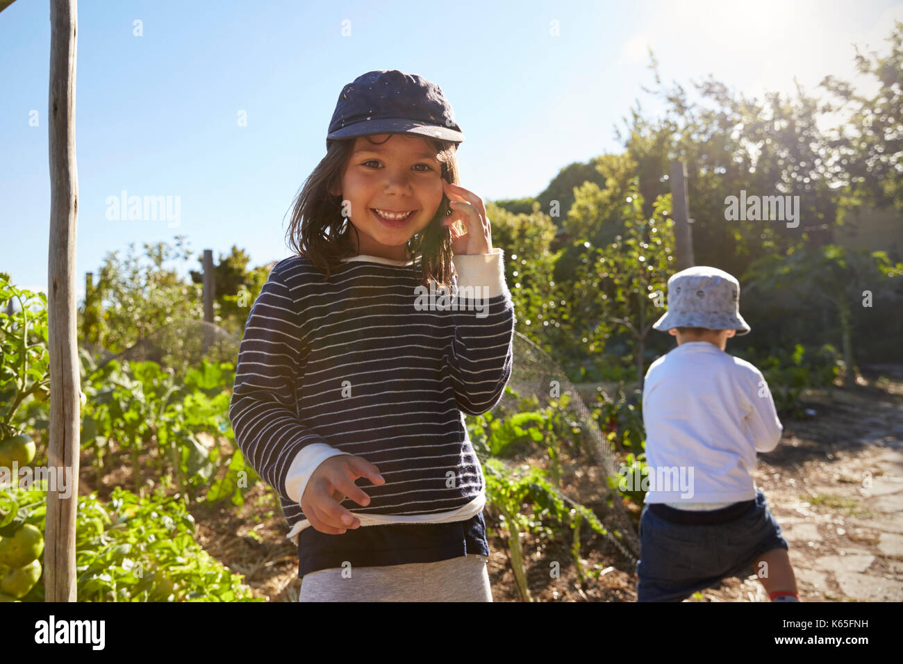 Two Children Playing On Allotment Together Stock Photo - Alamy