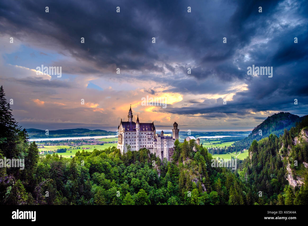 Neuschwanstein Castle at sunrise, seen from the bridge Marienbrücke ...