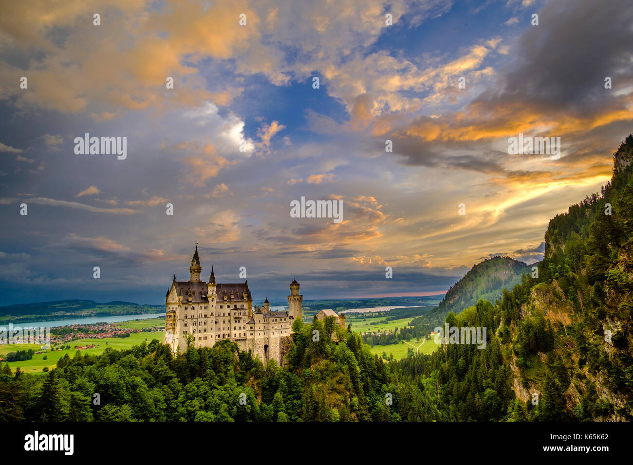 Neuschwanstein Castle at sunrise, seen from the bridge Marienbrücke ...