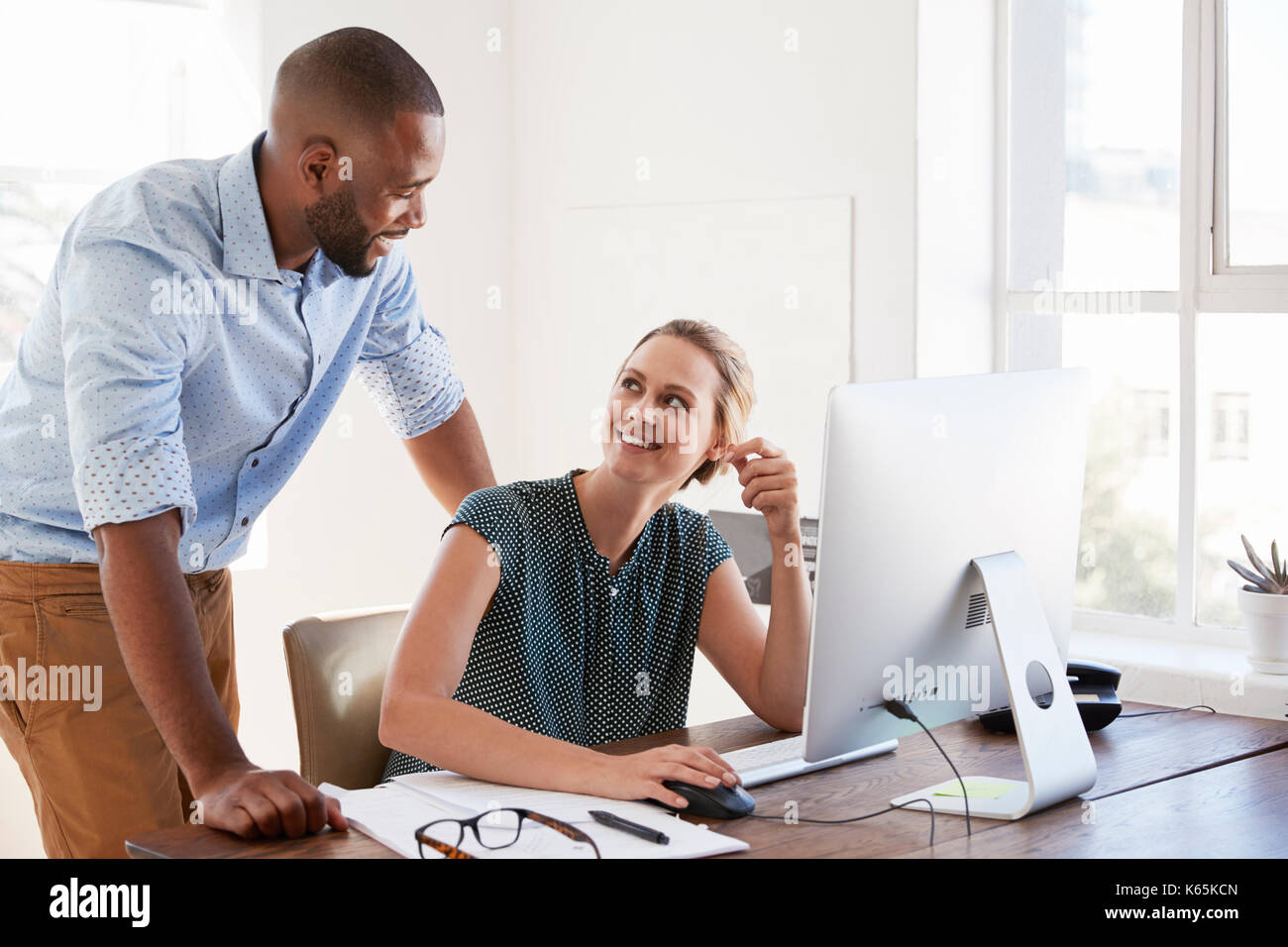 African woman colleagues talking desk hi-res stock photography and ...