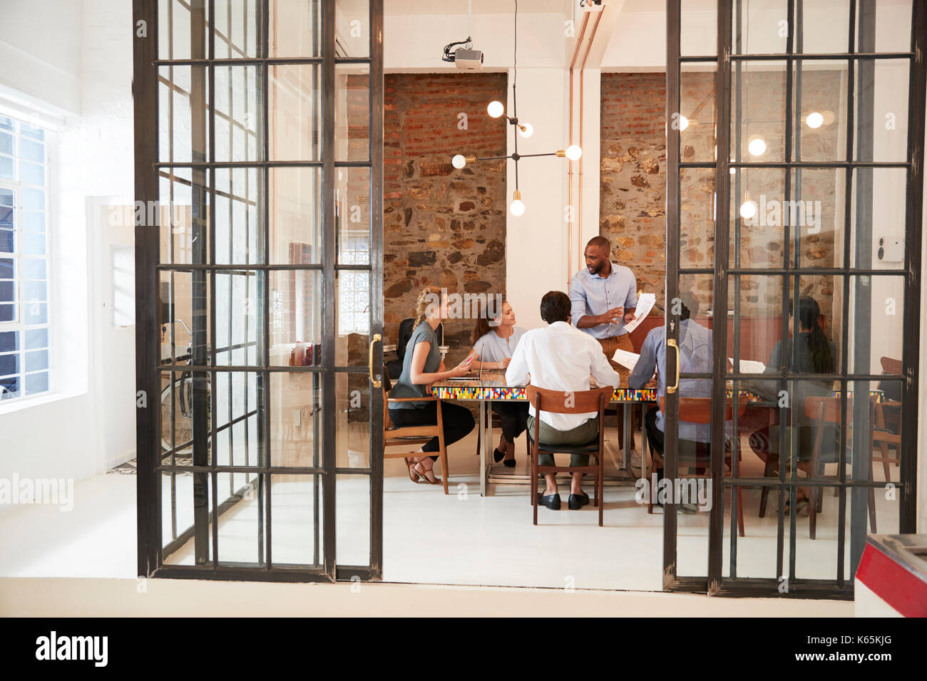 Young black man giving presentation in a meeting room Stock Photo - Alamy