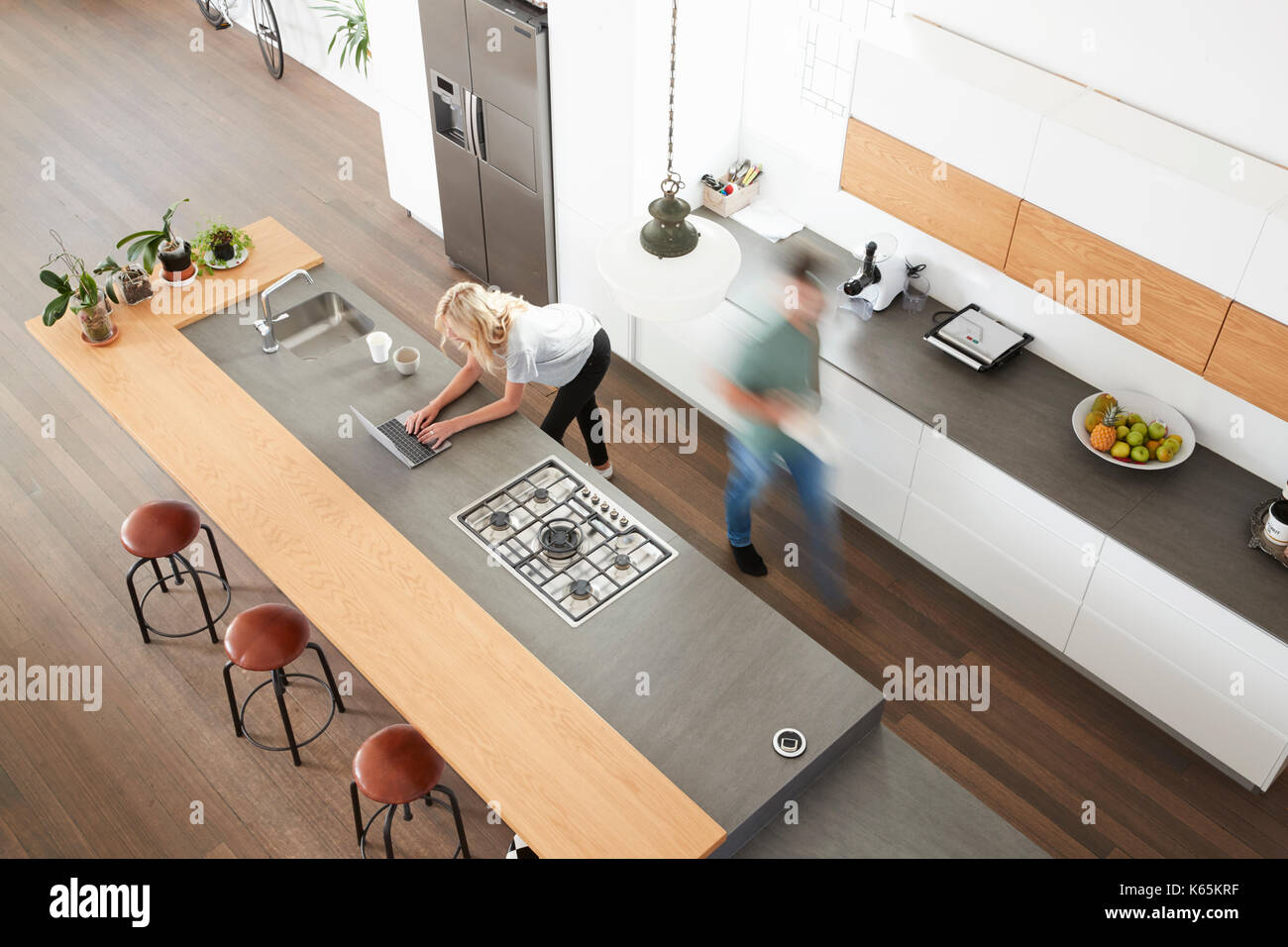 Overhead View Of Busy Couple In Modern Kitchen Stock Photo - Alamy