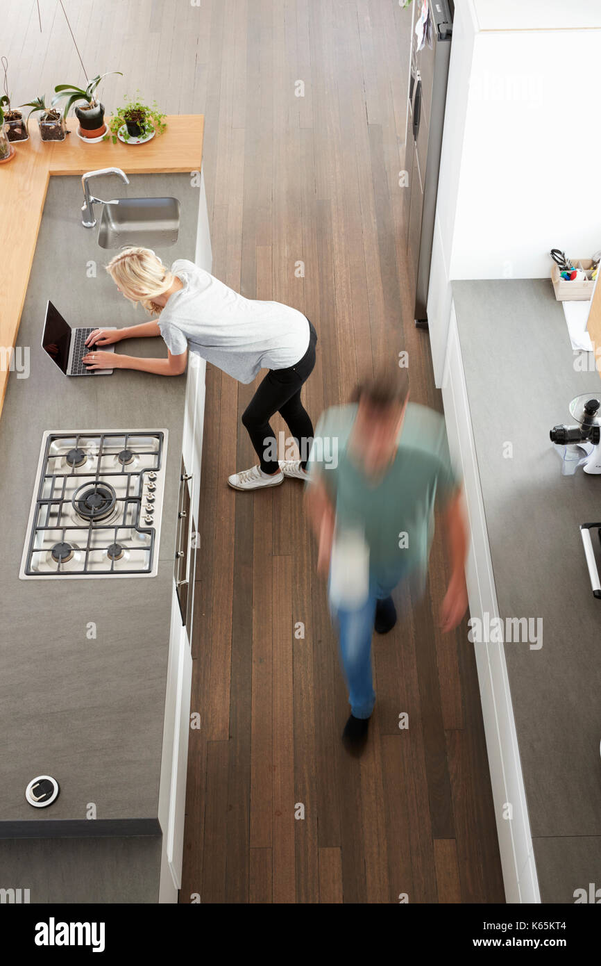 Overhead View Of Busy Couple In Modern Kitchen Stock Photo - Alamy