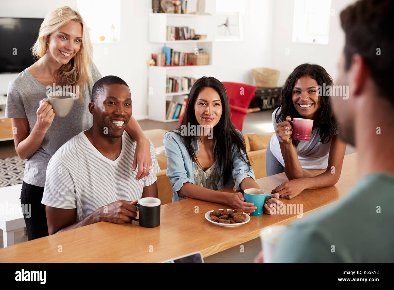 Friends Talking And Drinking Coffee In Modern Kitchen Stock Photo - Alamy