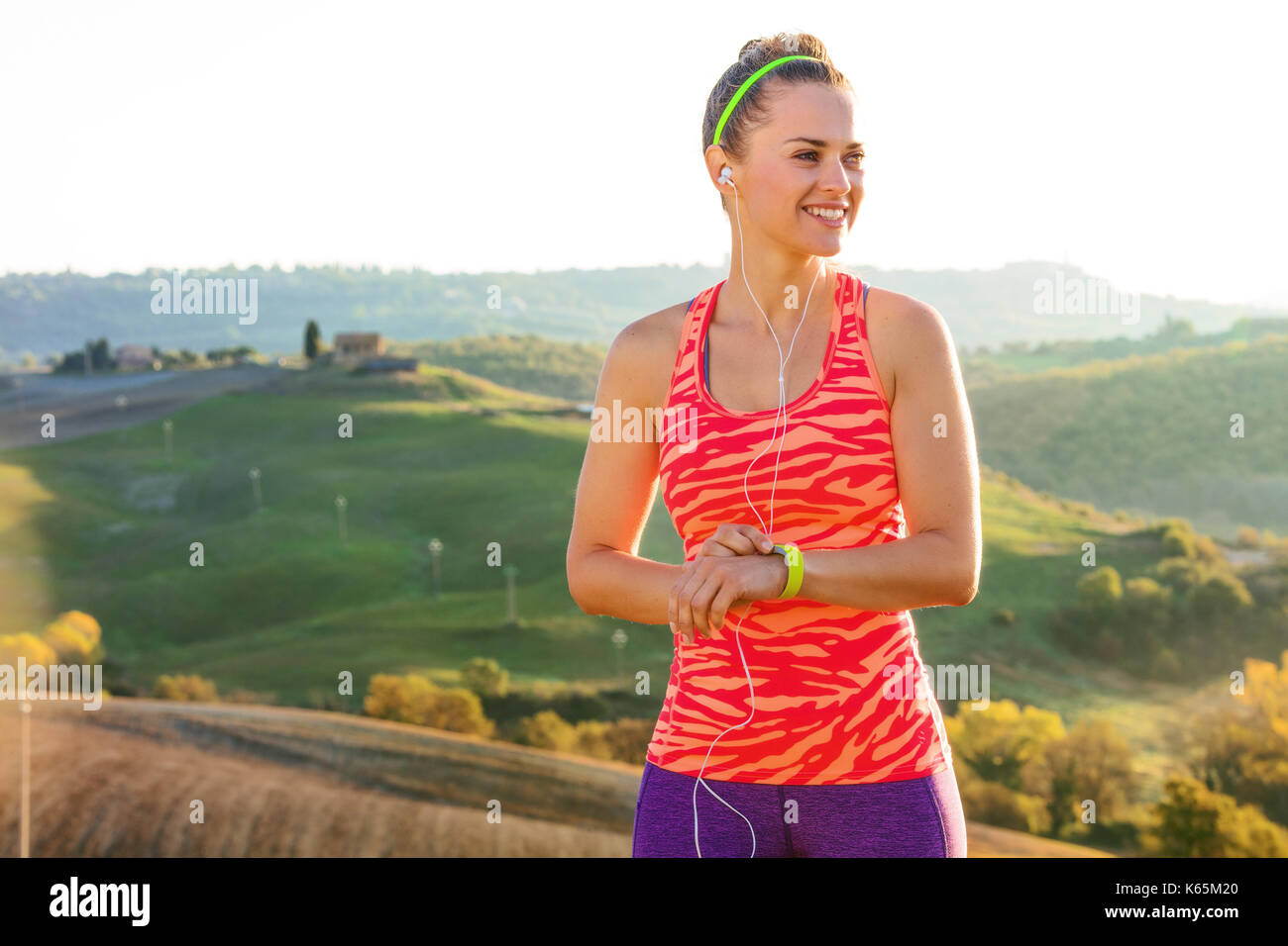 Fitness and magical views of Tuscany. happy healthy fit woman in sport ...