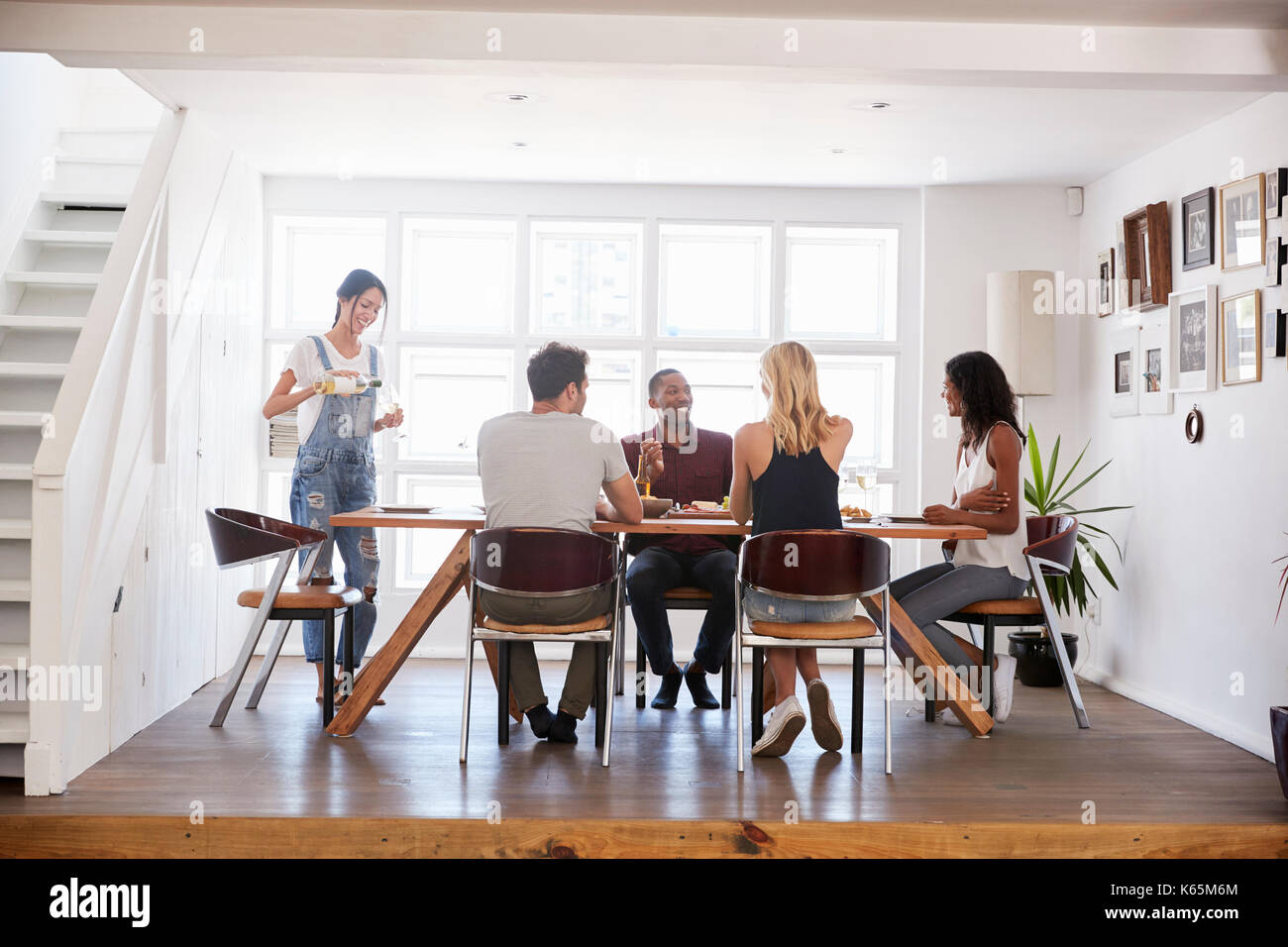Group Of Friends Enjoying Dinner Party At Home Together Stock Photo - Alamy