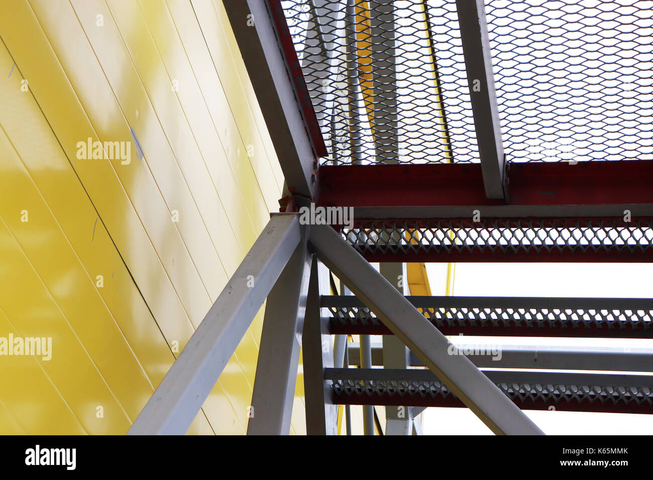 Metal structure with beams, stairs and podium with metal mesh. Urban ...
