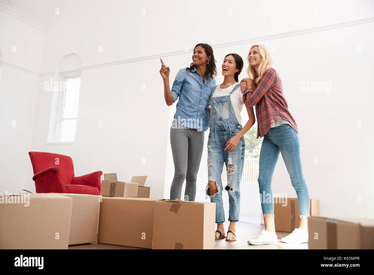 Three Female Friends Moving Into New Home Together Stock Photo - Alamy