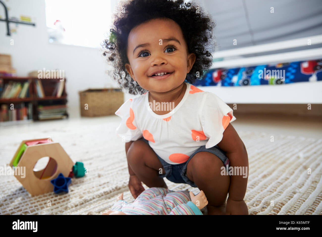 Cute Baby Girl Having Fun In Playroom With Toys Stock Photo - Alamy