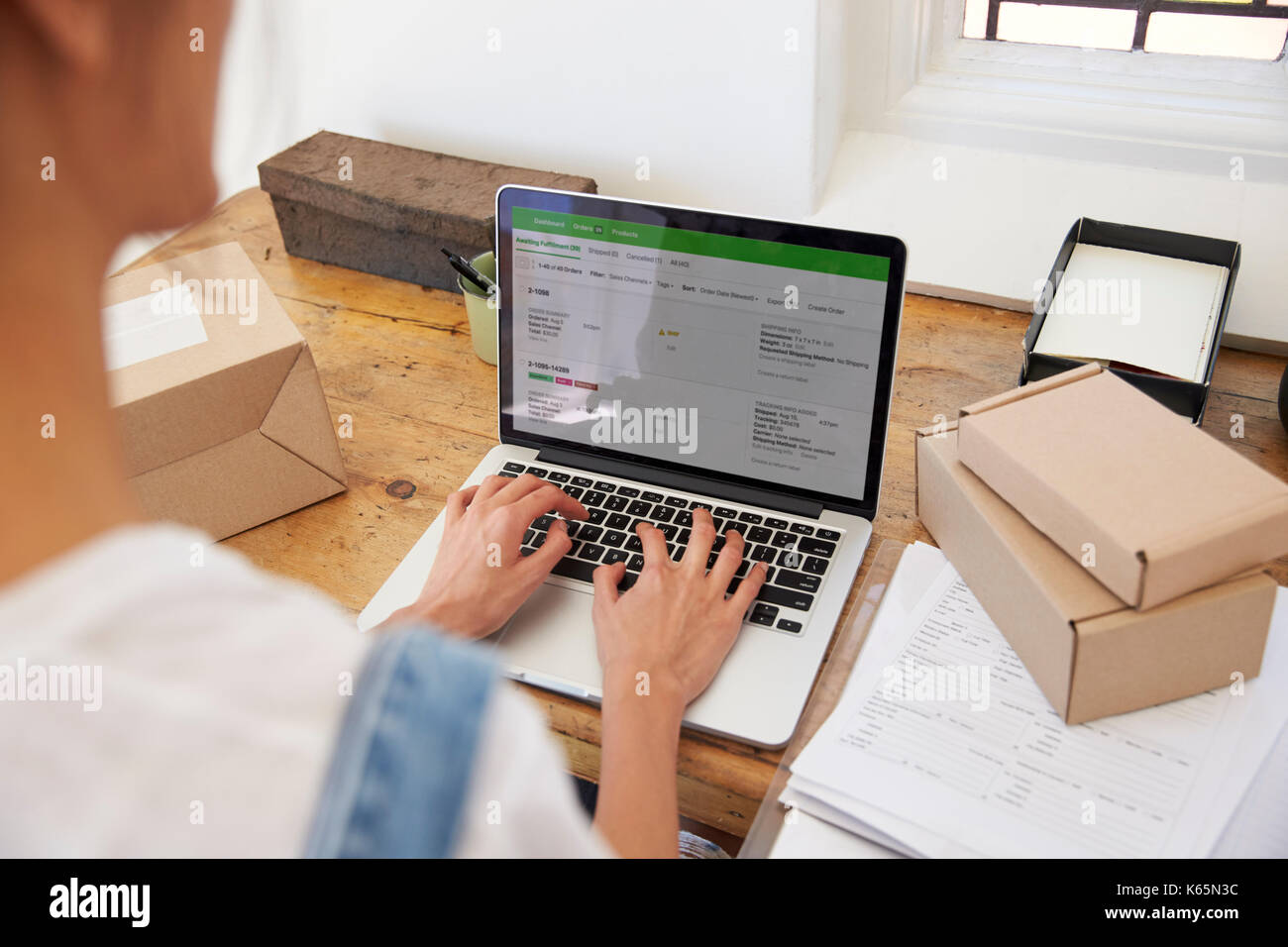 Close Up Of Woman Running Business From Home Dispatching Goods Stock Photo - Alamy