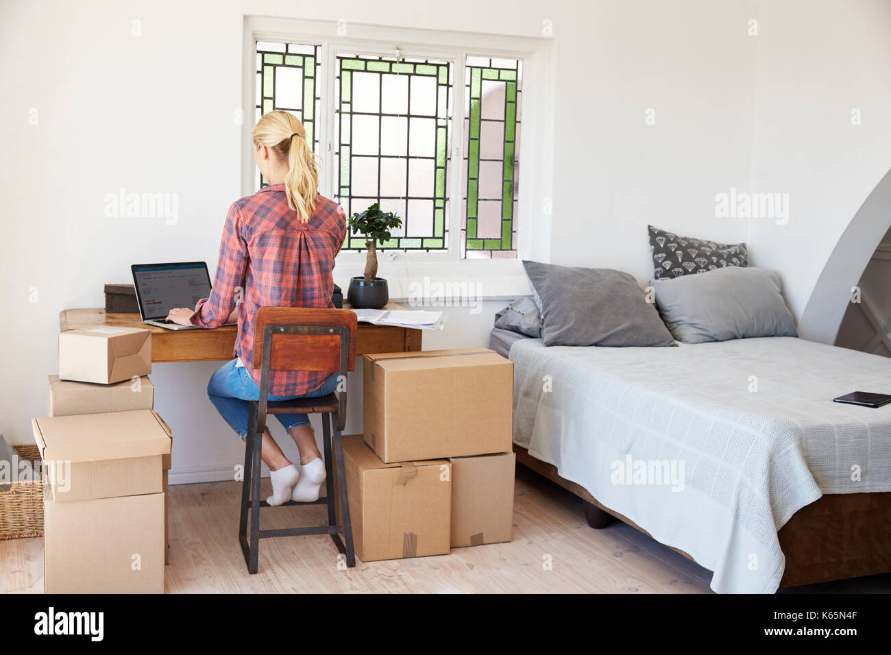 Woman Running Business From Home Working On Laptop Stock Photo - Alamy