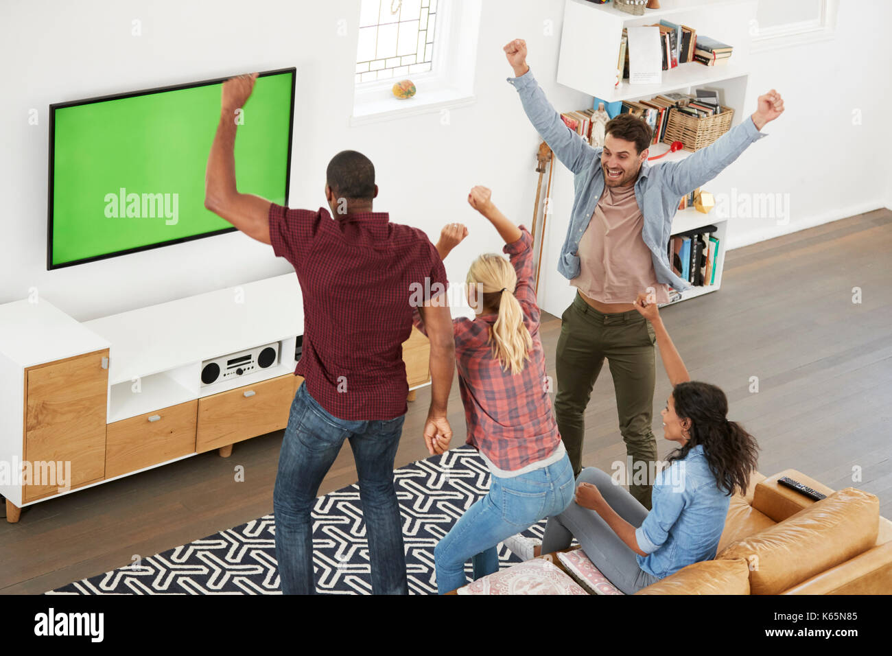 Person watching tv from behind hi-res stock photography and images - Alamy