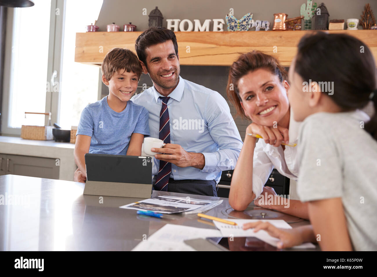 Parents Helping Children With Homework Before Going To Work Stock Photo ...
