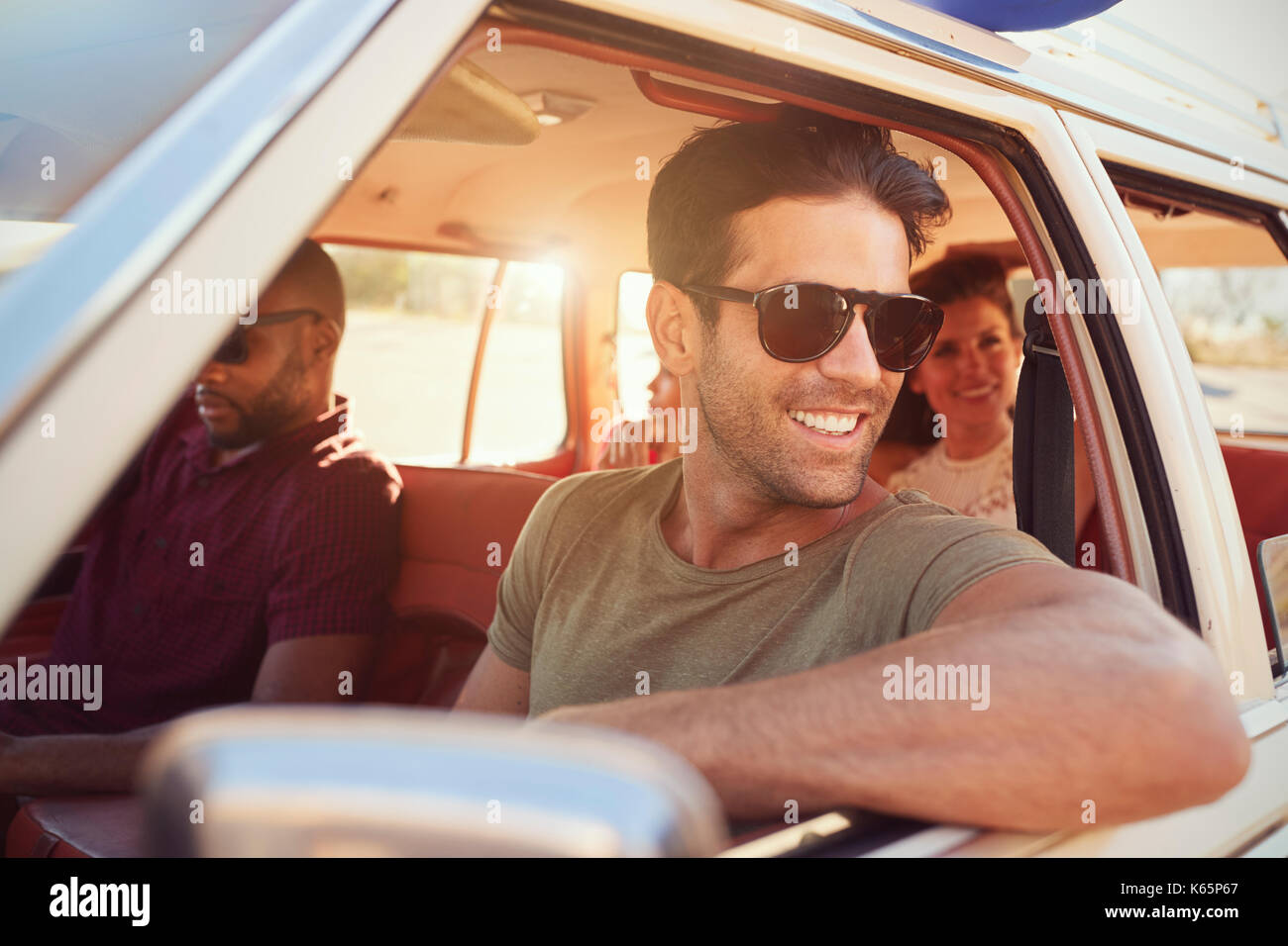 Group Of Friends Relaxing In Car During Road Trip Stock Photo - Alamy