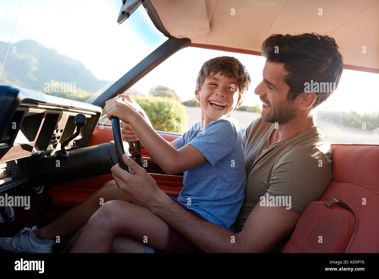 Father teaching son to drive car hi-res stock photography and images ...