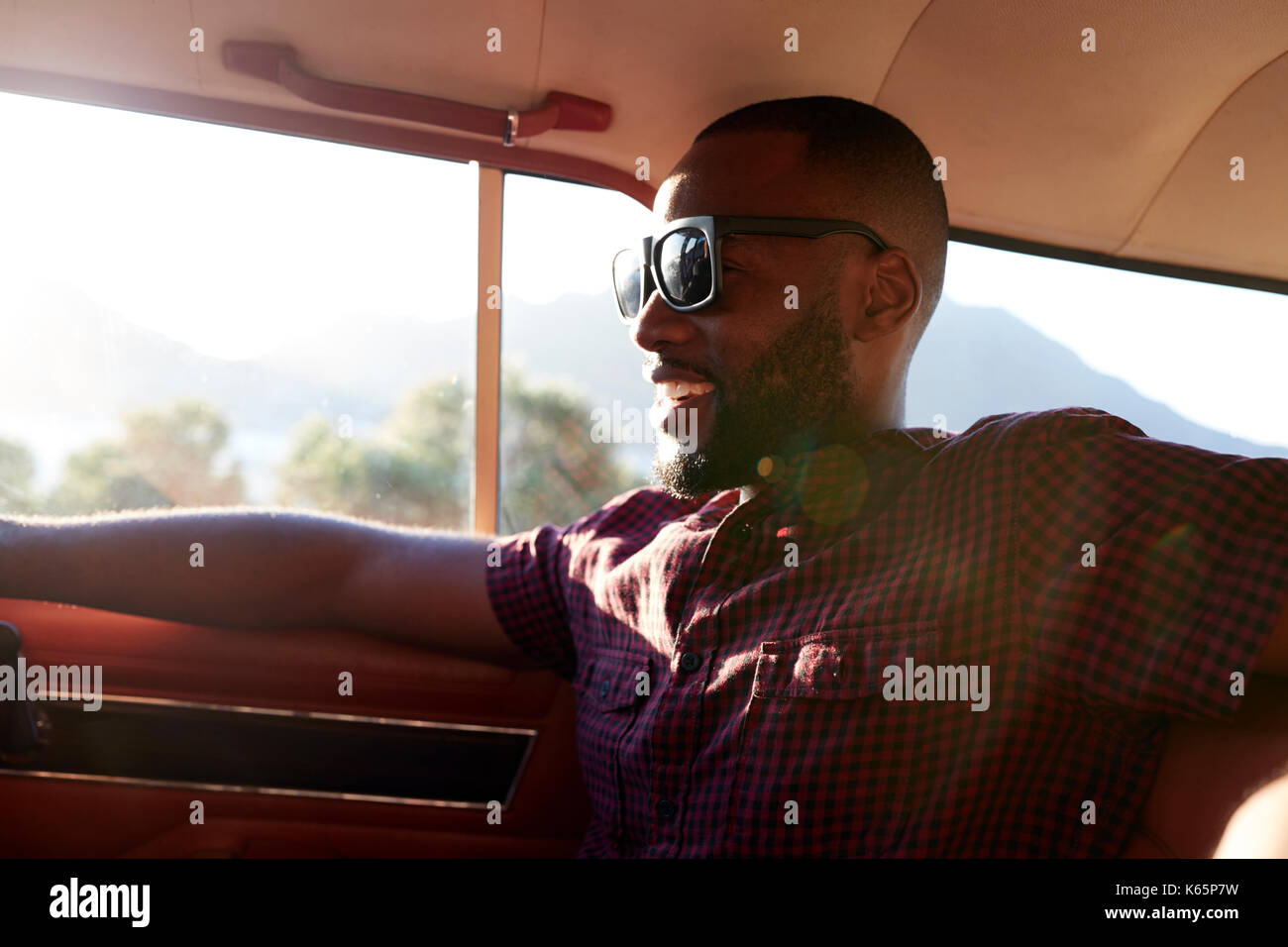Man Relaxing In Car During Road Trip Stock Photo - Alamy