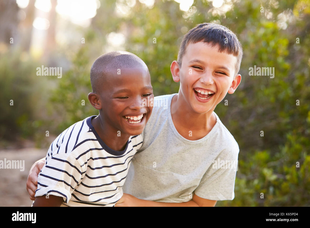 Friendship boys embracing hi-res stock photography and images - Alamy