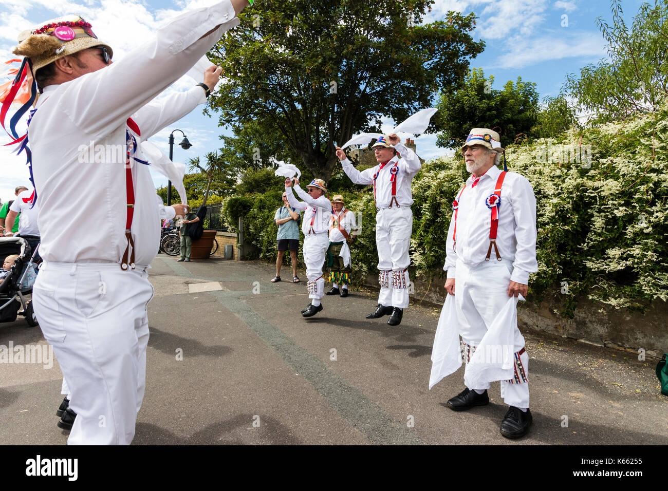 Traditional Hartley Morris dancers, in white trousers and shirts, red ...