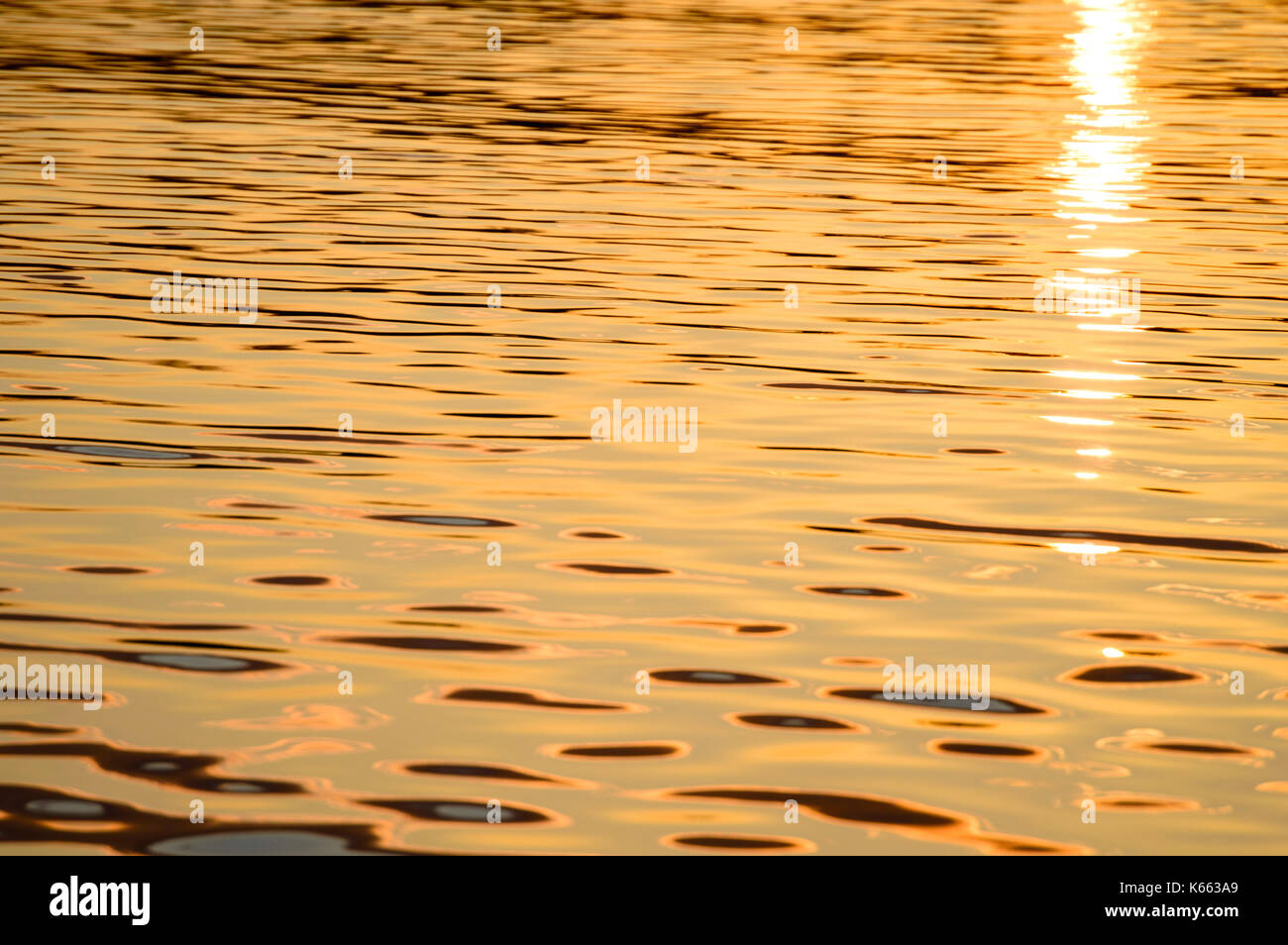 Reflections in the calm lake water. abstract background texture Stock ...