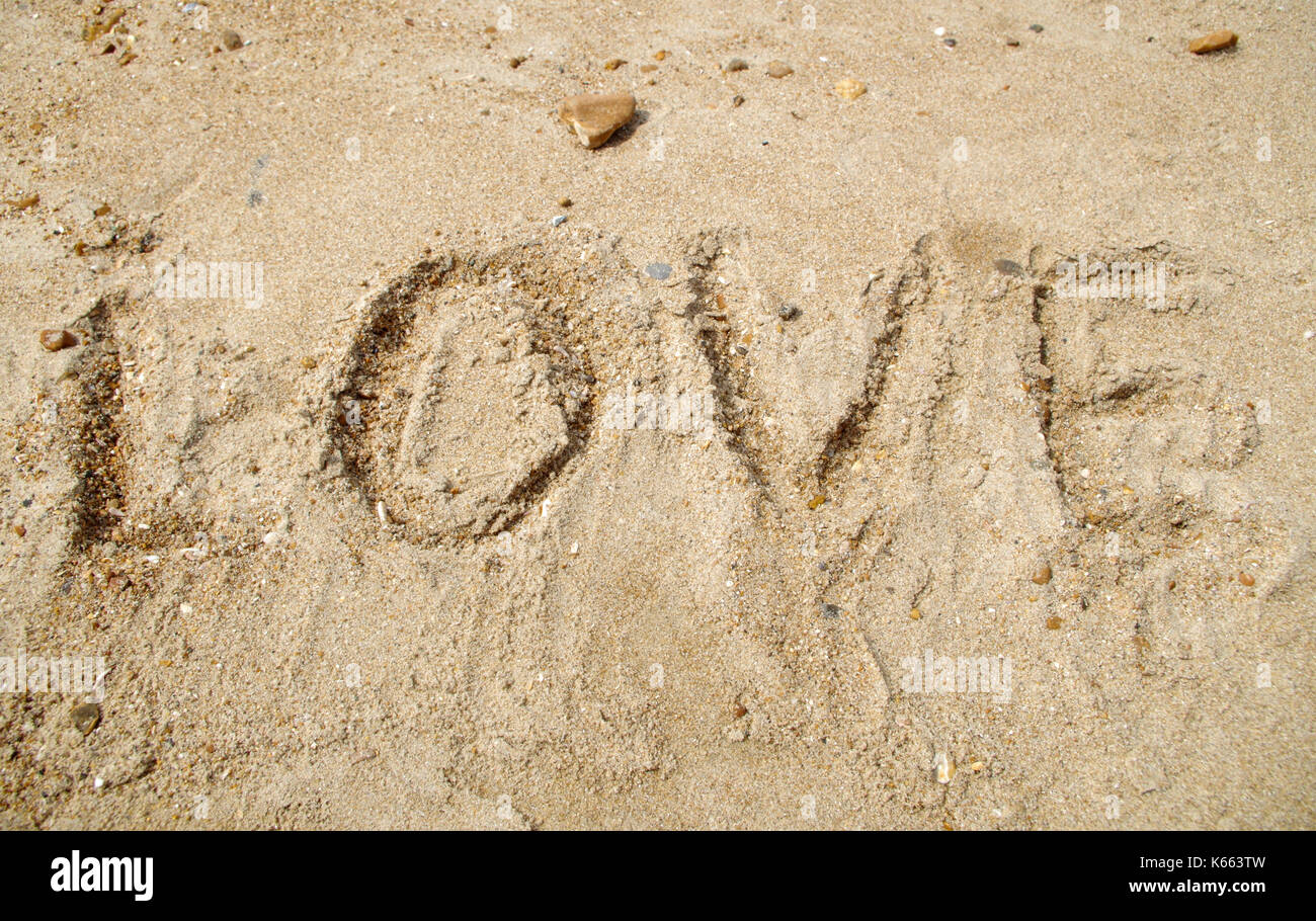 Love written in the sand Stock Photo - Alamy