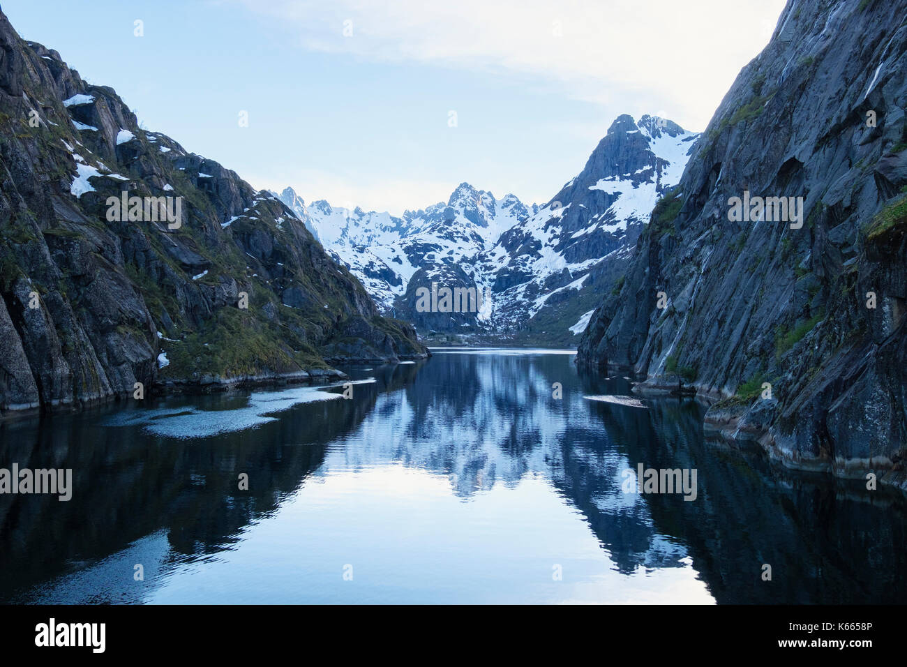 Mountains reflected in narrow Trollfjord or Trollfjorden fjord ...