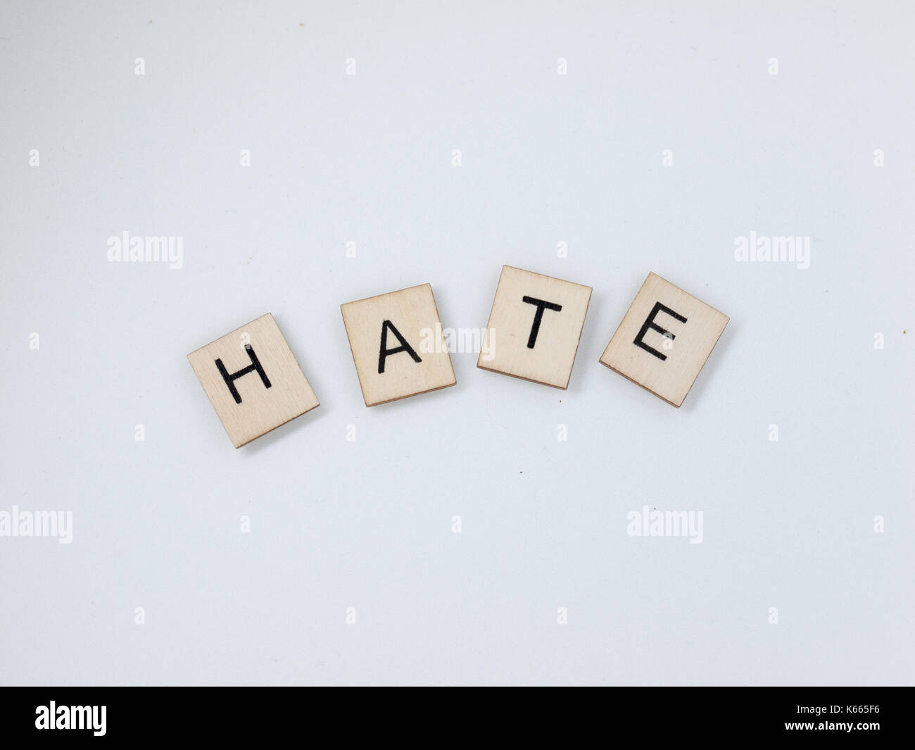 The word "Hate" spelled out with wooden letter tiles Stock Photo - Alamy