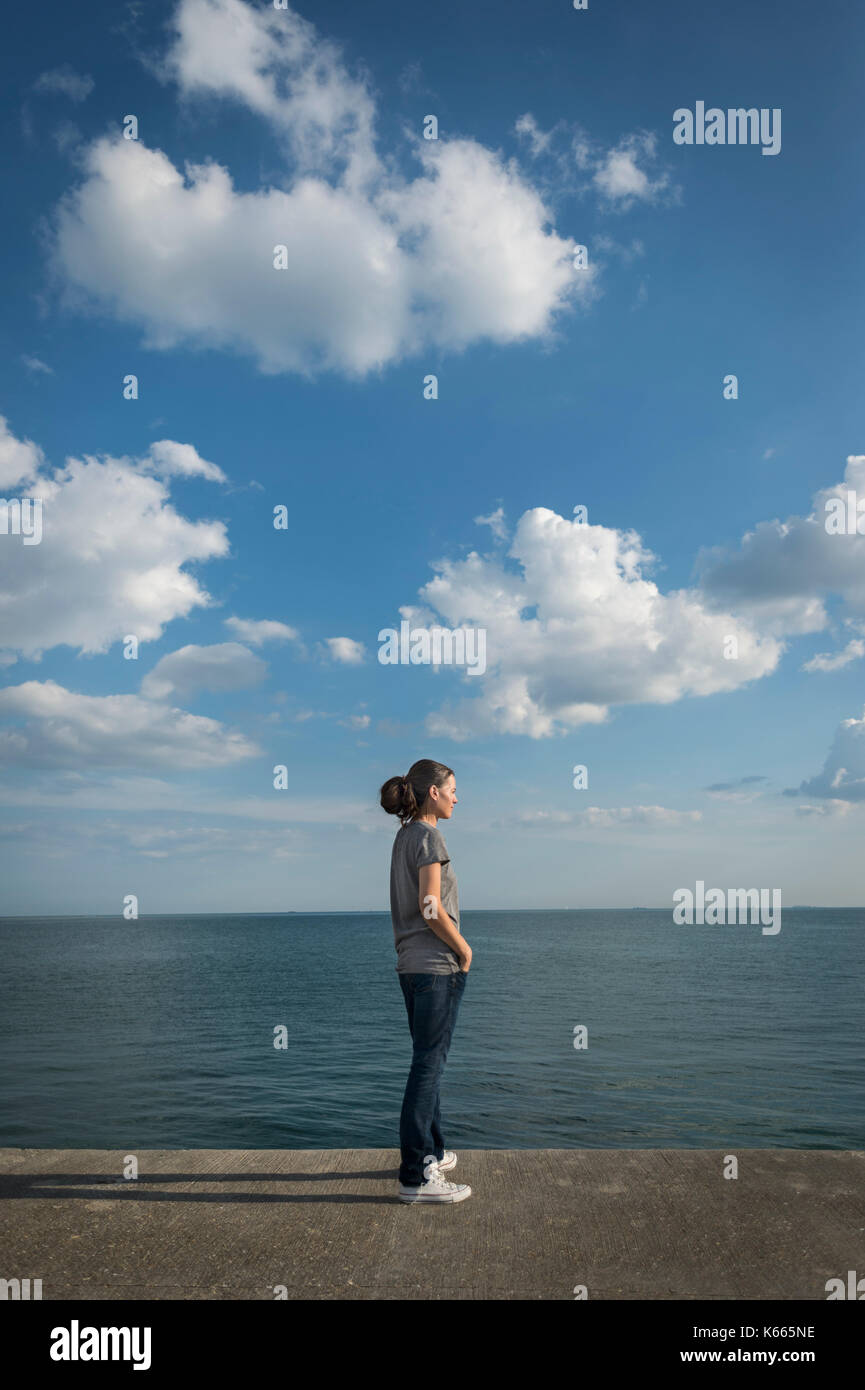 woman looking out to sea Stock Photo - Alamy