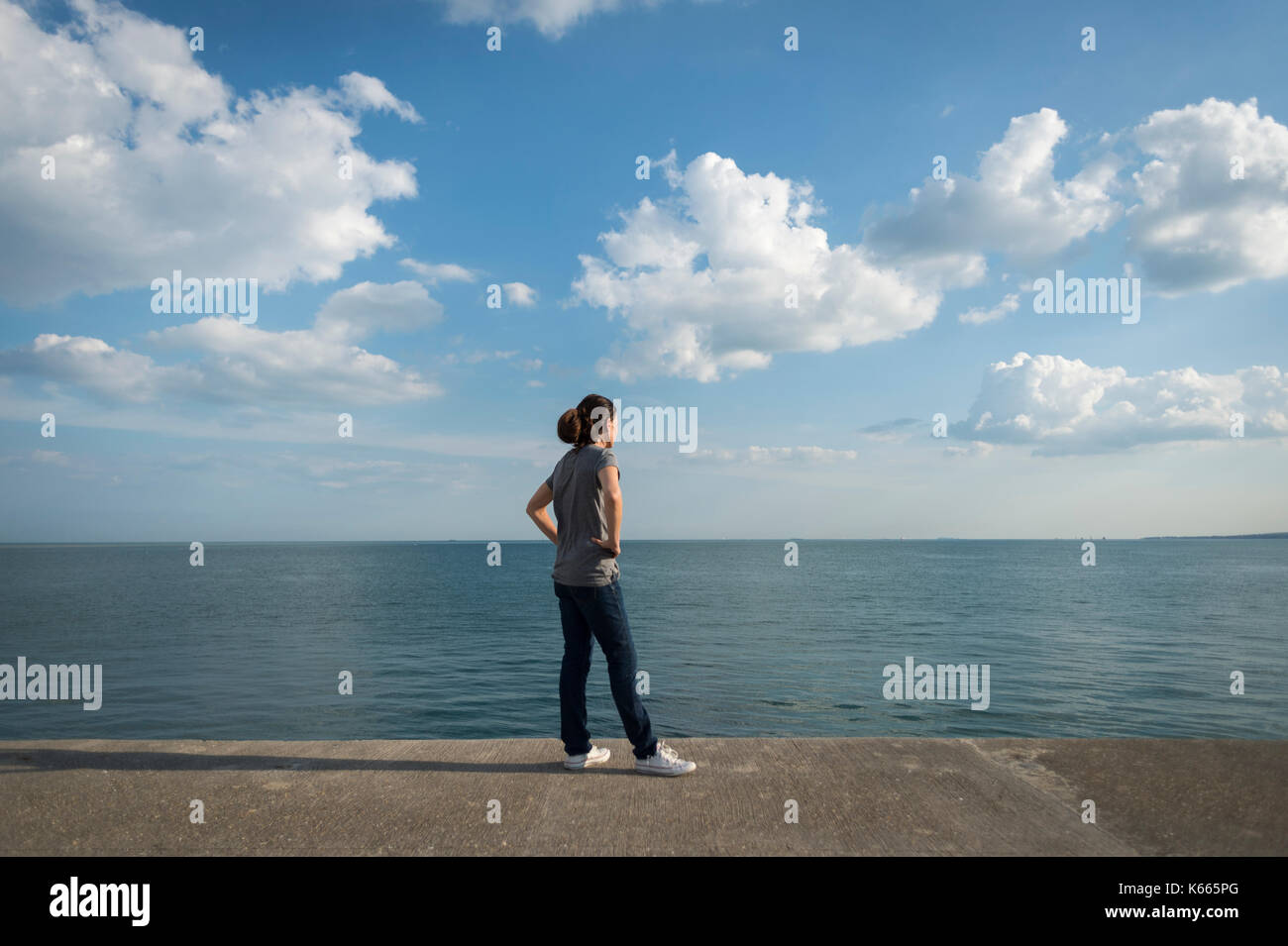 woman looking out to sea Stock Photo - Alamy