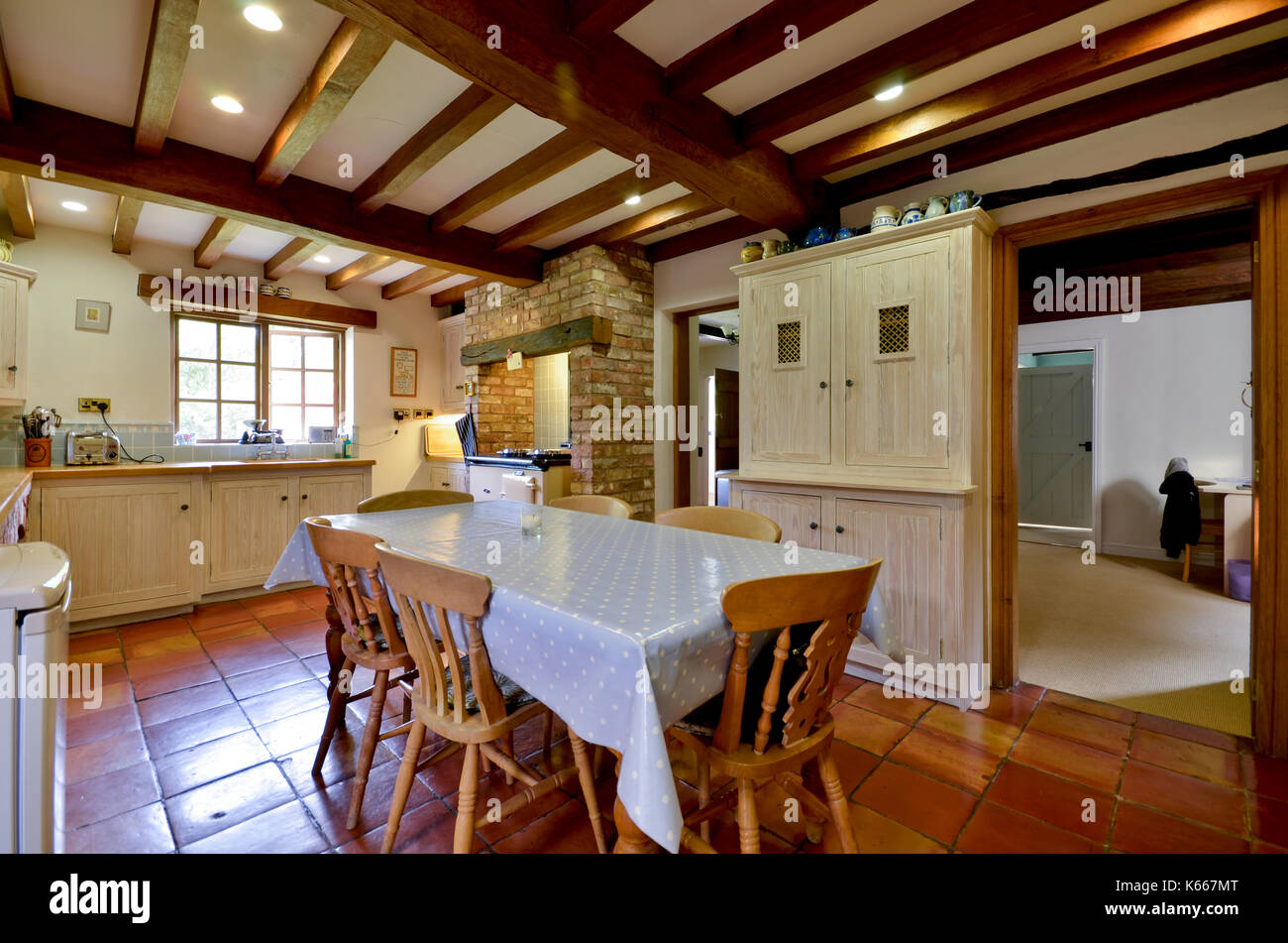 Family dining kitchen in country cottage Stock Photo - Alamy