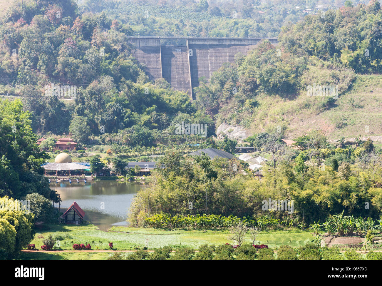 Small concrete dam for irrigation in the valley near the oragen garden ...