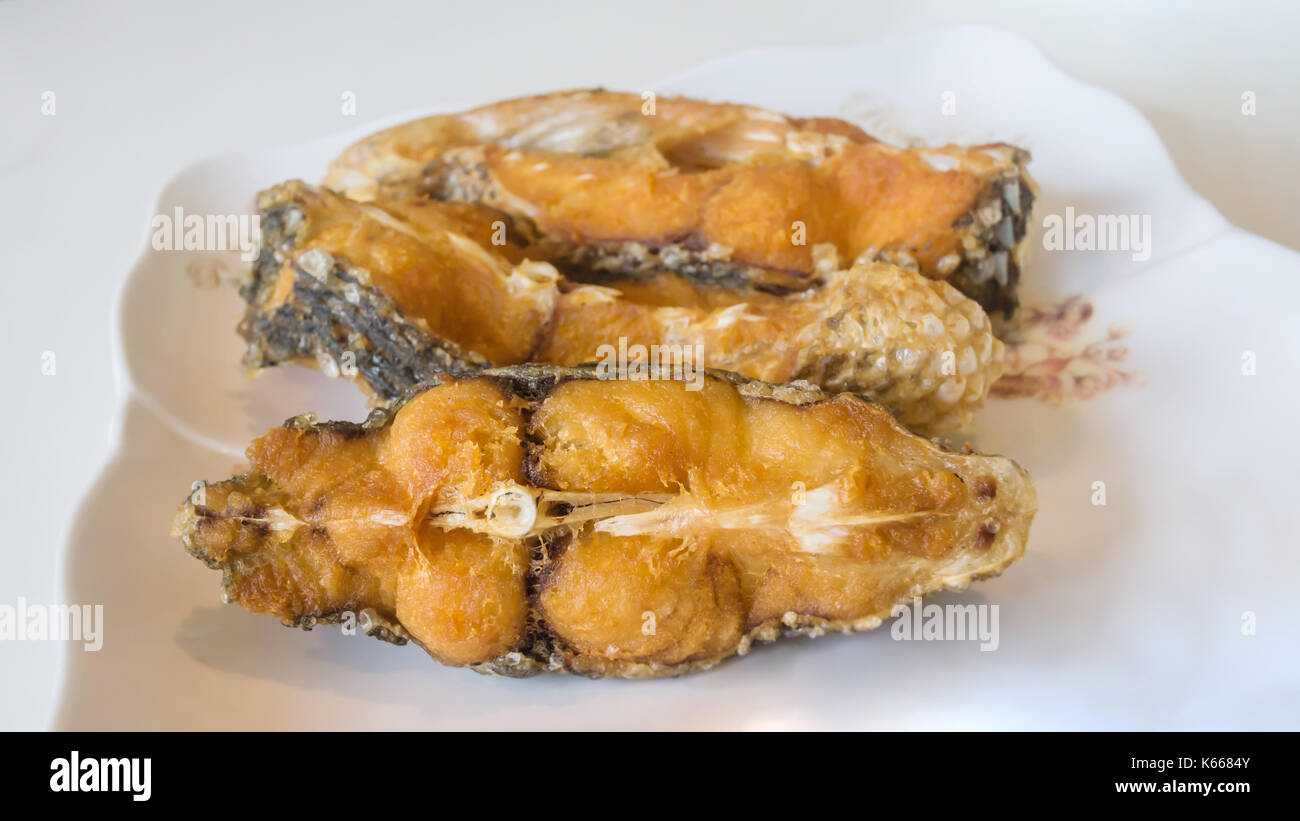 Crispy fish pieces, close up seafood dish Stock Photo - Alamy