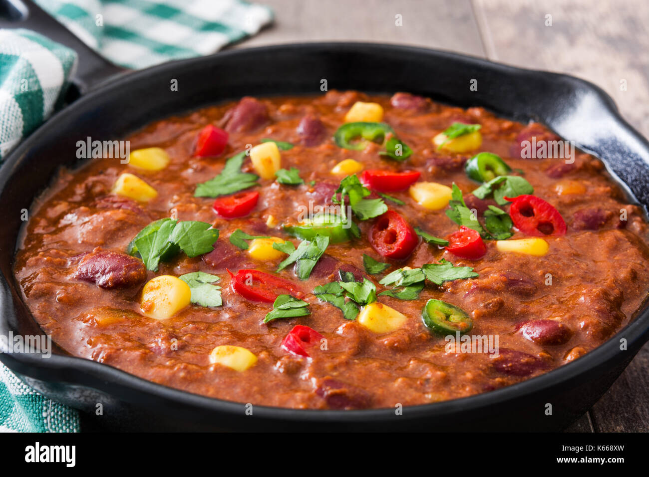 Traditional mexican tex mex chili con carne in a frying pan on wooden ...