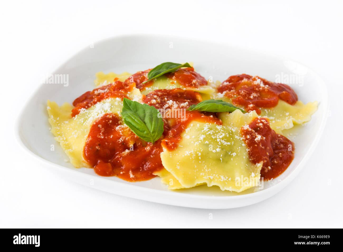 Ravioli with tomato sauce and basil isolated on white background Stock ...