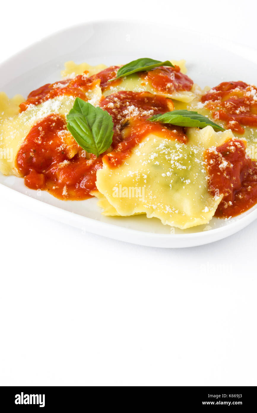 Ravioli with tomato sauce and basil isolated on white background Stock ...