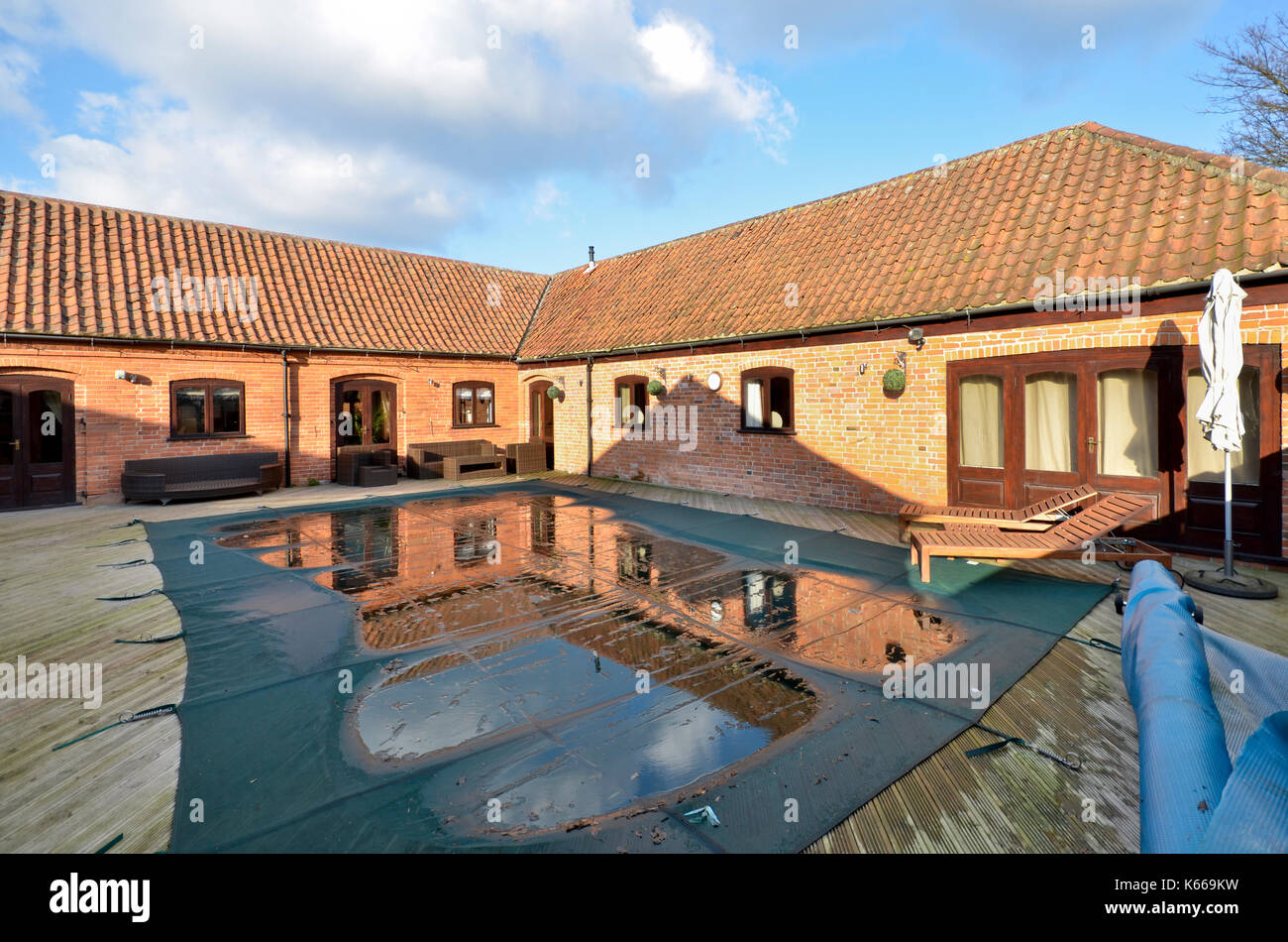 Courtyard swimming pool in luxury home Stock Photo - Alamy