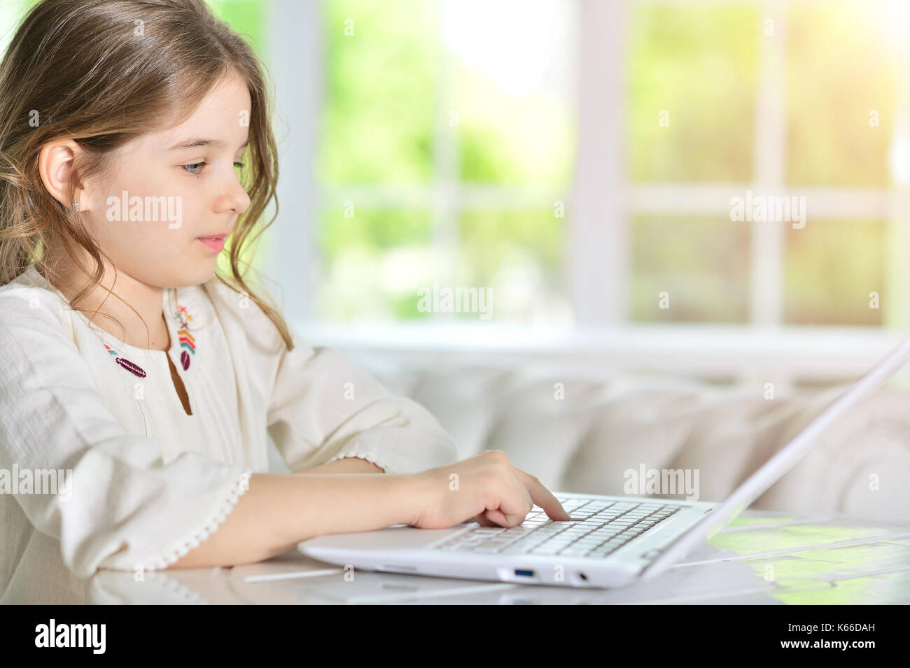 Little girl using laptop Stock Photo - Alamy Little girl using laptop Stock Photo - Alamy
