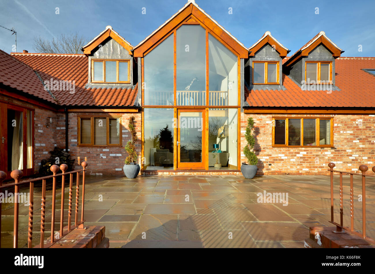 Large glazed entrance to luxury new build home Stock Photo - Alamy