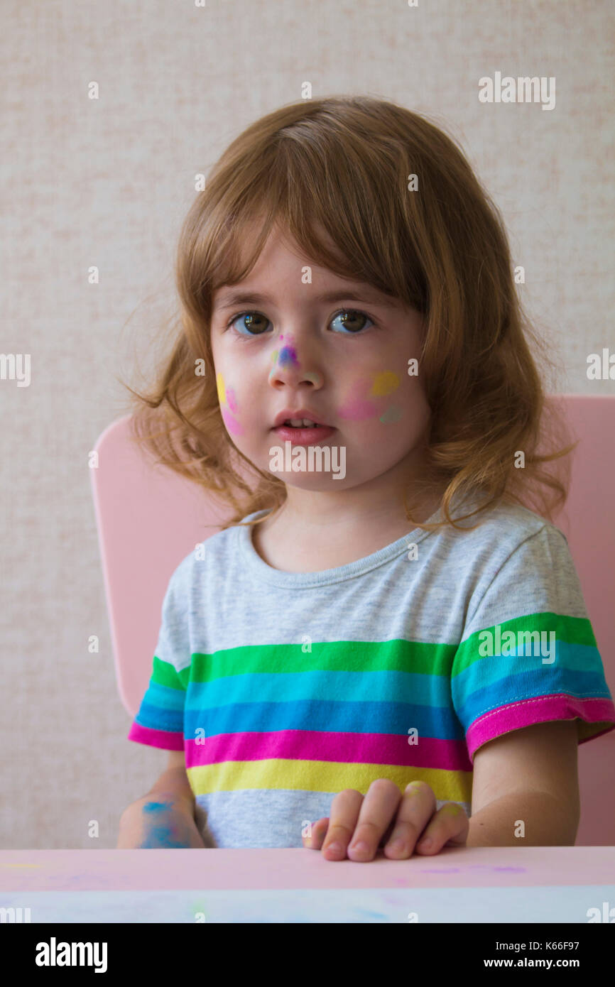 Child painted hand face hi-res stock photography and images - Alamy