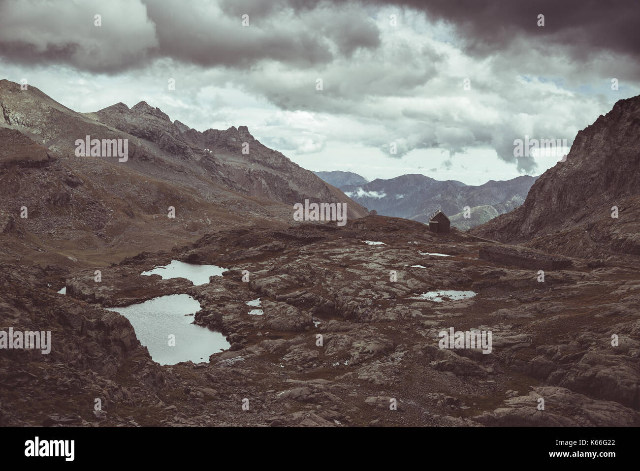 High altitude rocky landscape and little lake. Majestic alpine ...