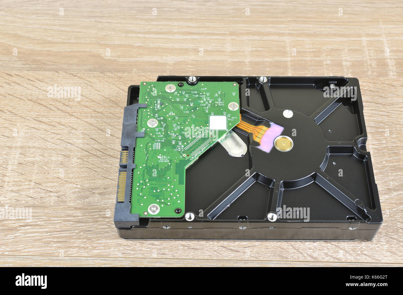 Bottom side of a computer hard disk on a wooden desk Stock Photo - Alamy