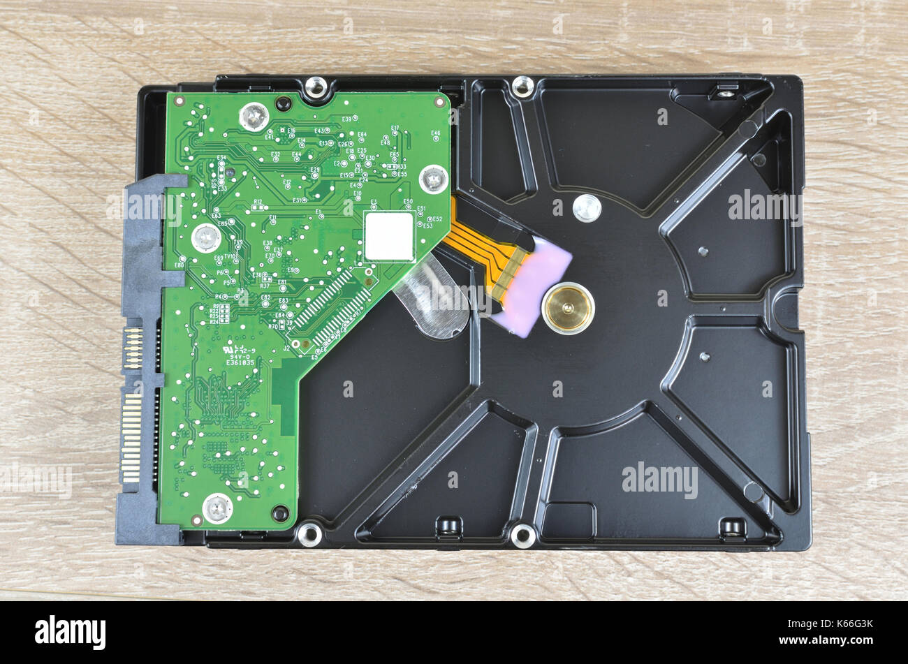 Bottom side of a computer hard disk on a wooden desk Stock Photo - Alamy
