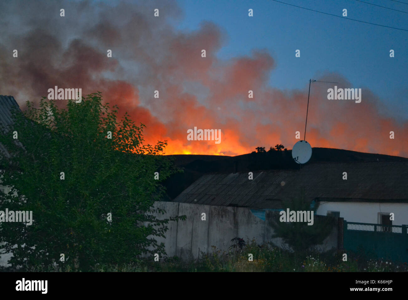 fire coming from the mountain to the village Stock Photo - Alamy