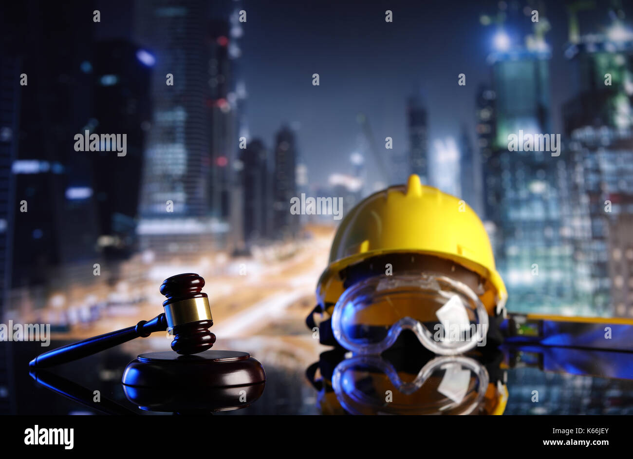 Law theme. Construction law's symbols - helmet and gavel Stock Photo ...