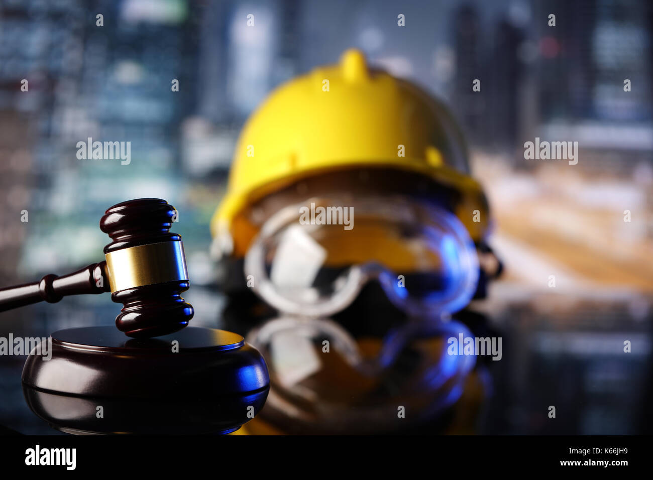 Law theme. Construction law's symbols - helmet and gavel Stock Photo ...
