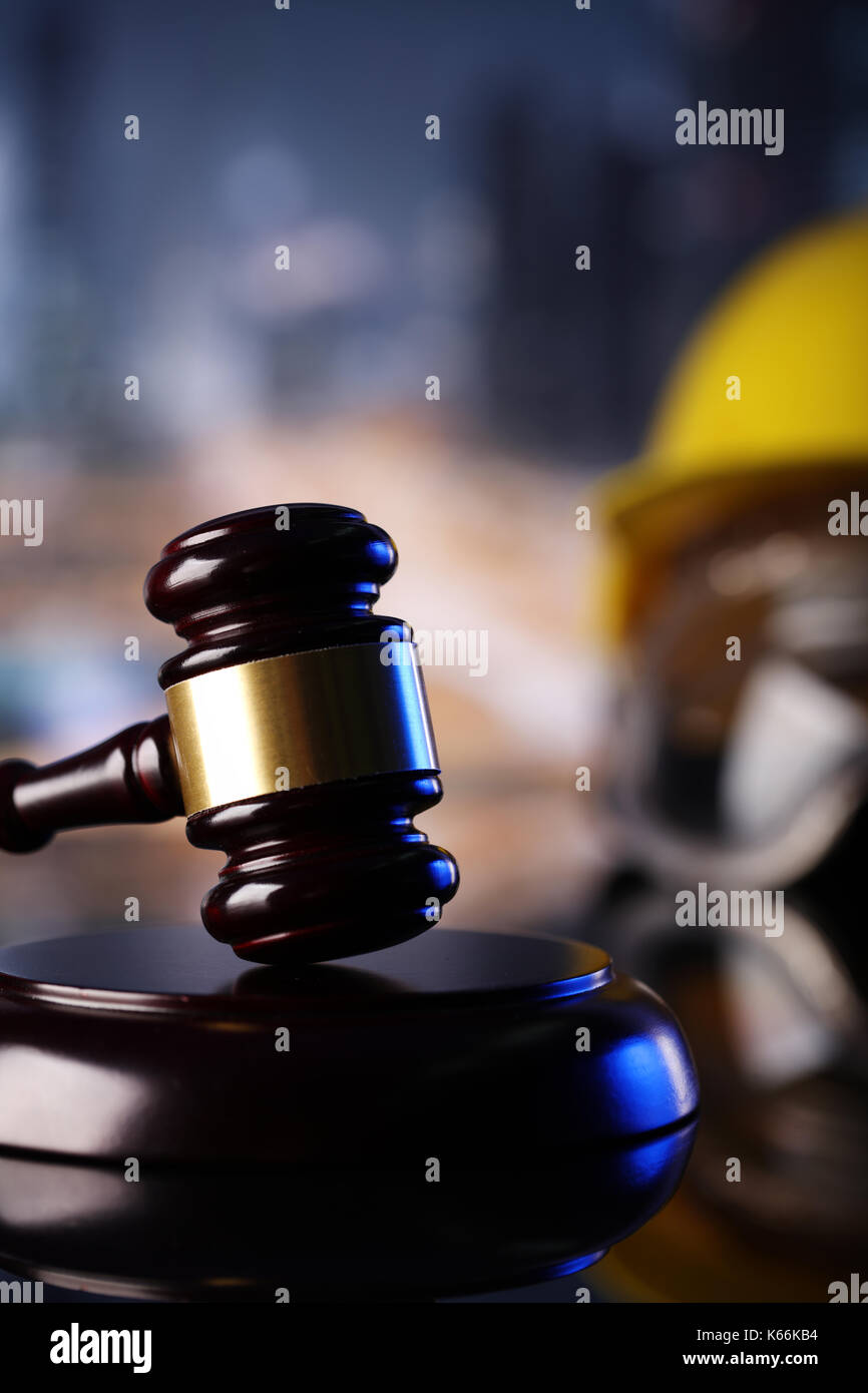 Law theme. Construction law's symbols - helmet and gavel Stock Photo ...