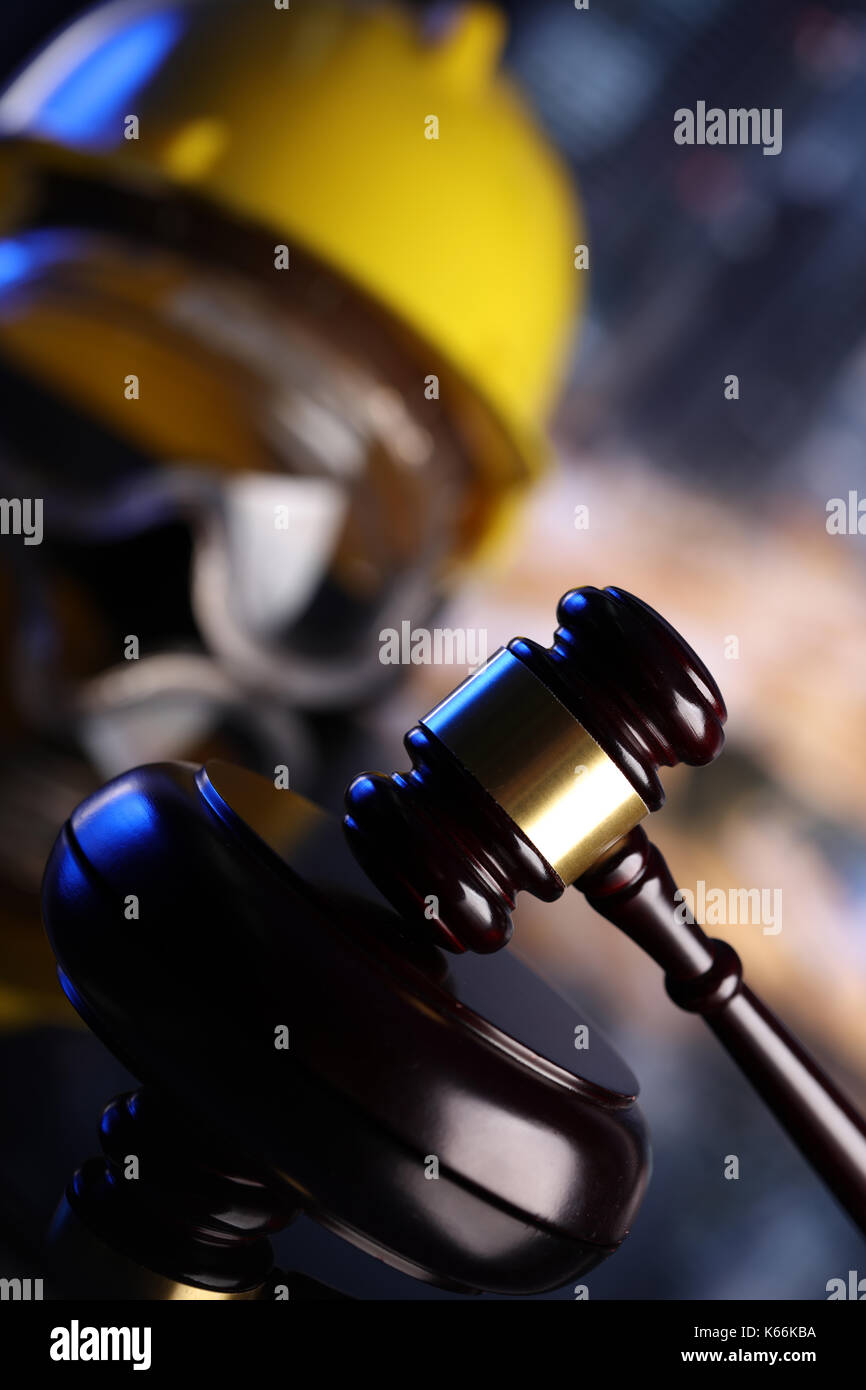 Law theme. Construction law's symbols - helmet and gavel Stock Photo ...