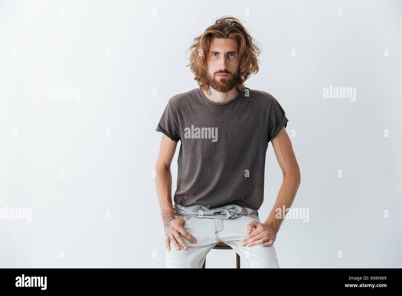 Image of caucasian handsome young bearded man standing isolated over ...